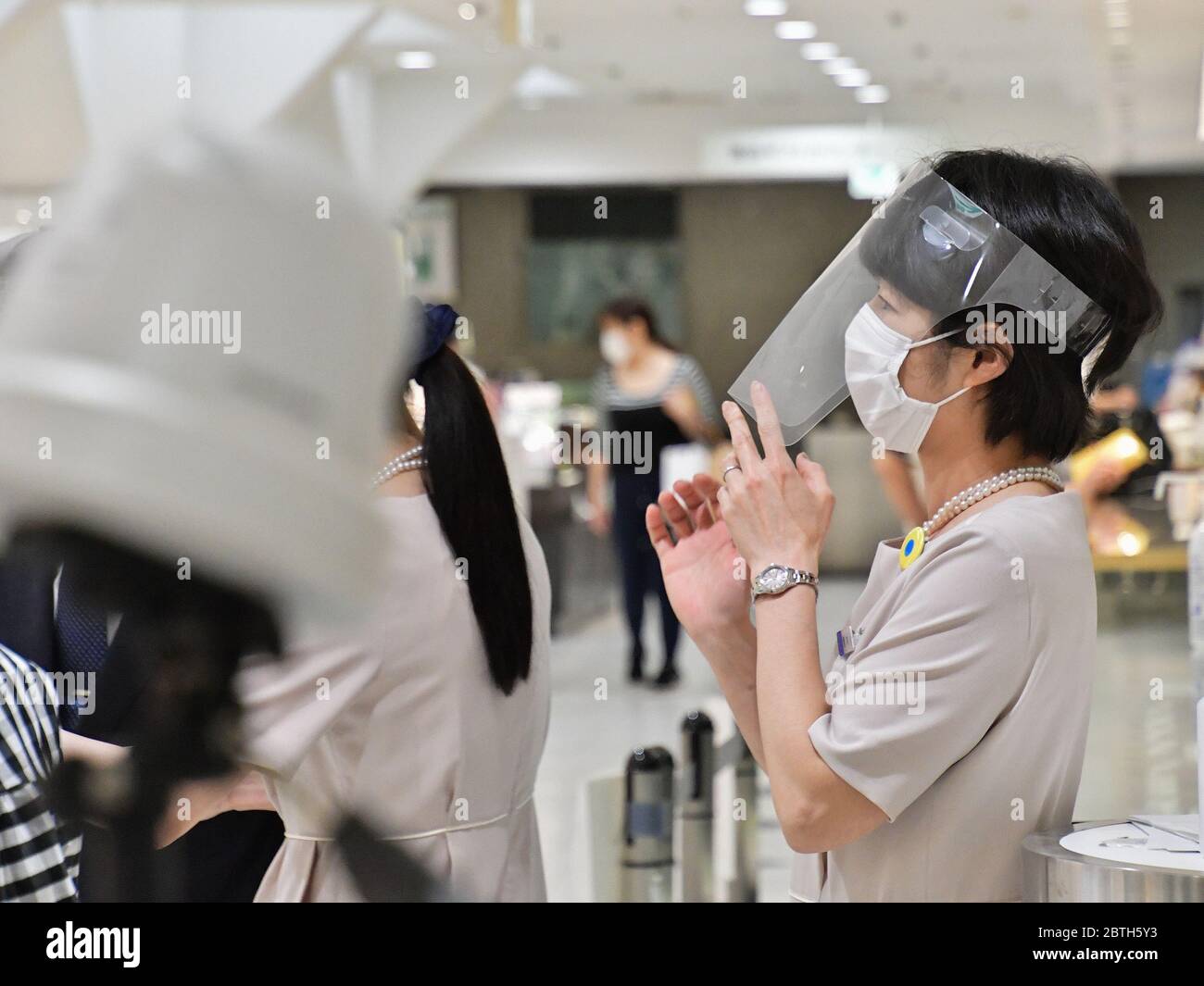 Employees wearing face shields and face masks are seen at the Matsuya ...