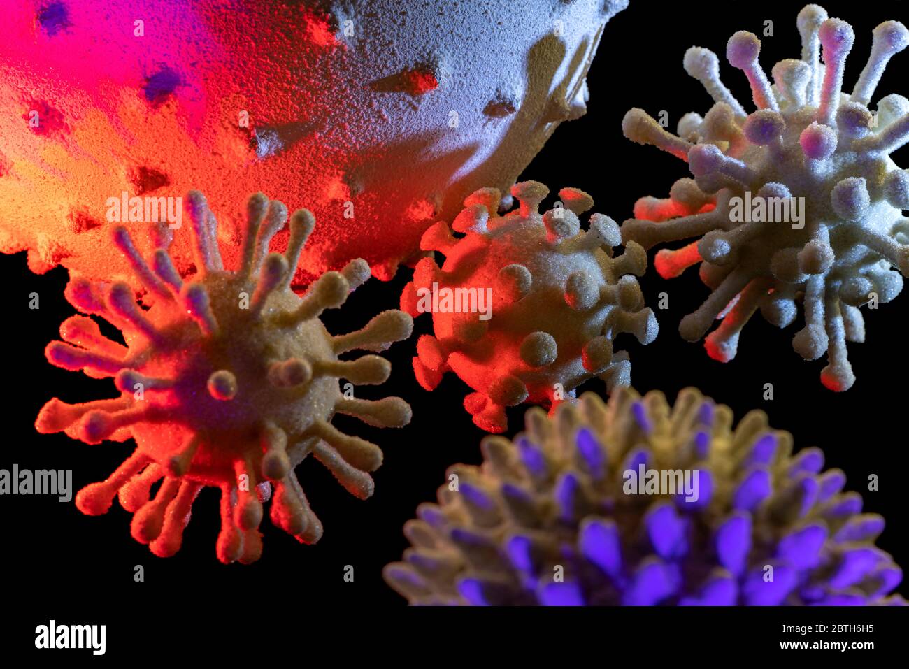 picture of some colorful illuminated symbolic viruses in dark back ...