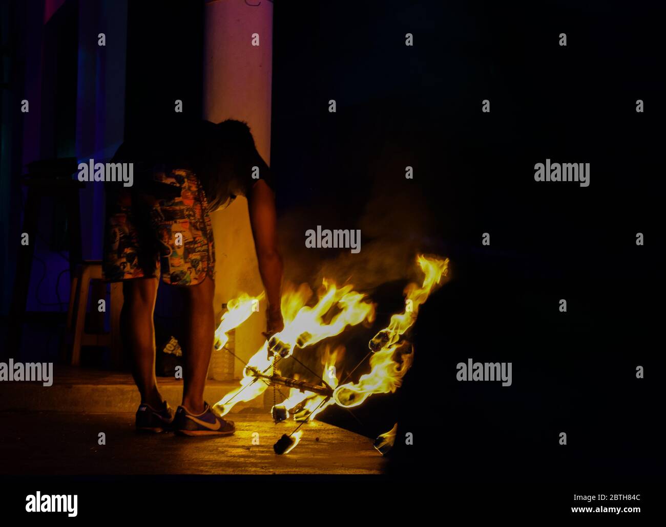 MAN DANCING AND ABSTRACT FIGURES MADE WITH FIRE Stock Photo - Alamy