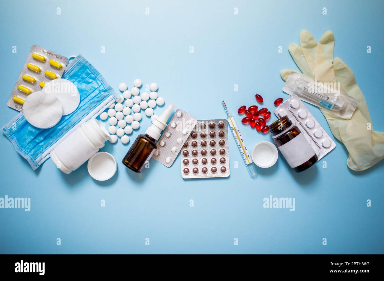 Different medications in containers and bottles, tablets and capsules ...