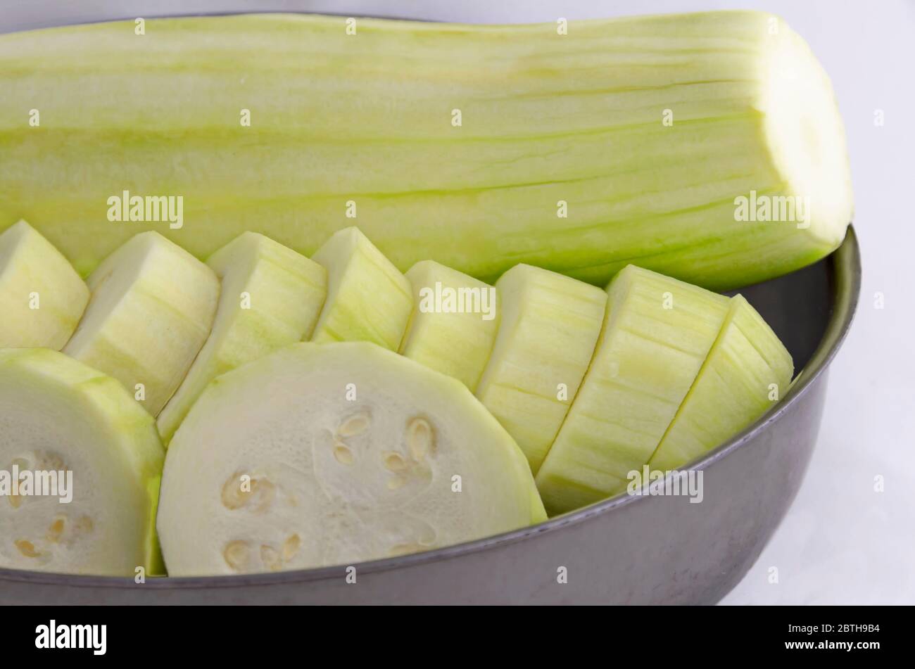 Slices of fresh raw zucchini, courgette, Cucurbita or squash vegetable ...