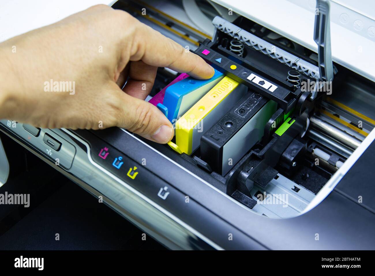 Technicians are install setup the ink cartridge of a inkjet printer the ...