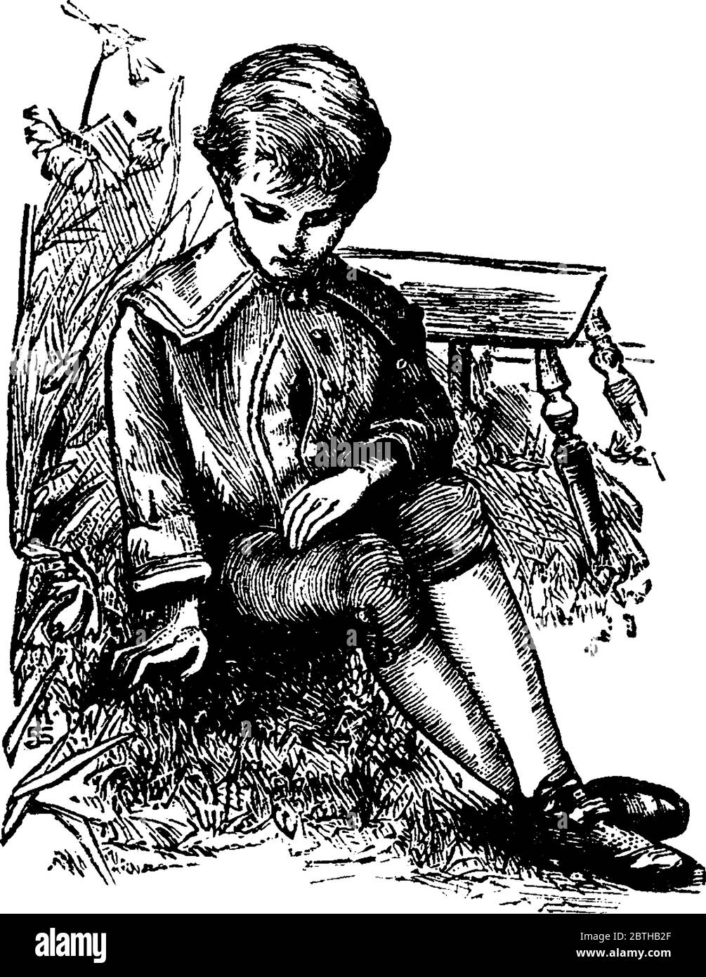 A young Boy Sitting on a grassy dome behind a bench and looking ...