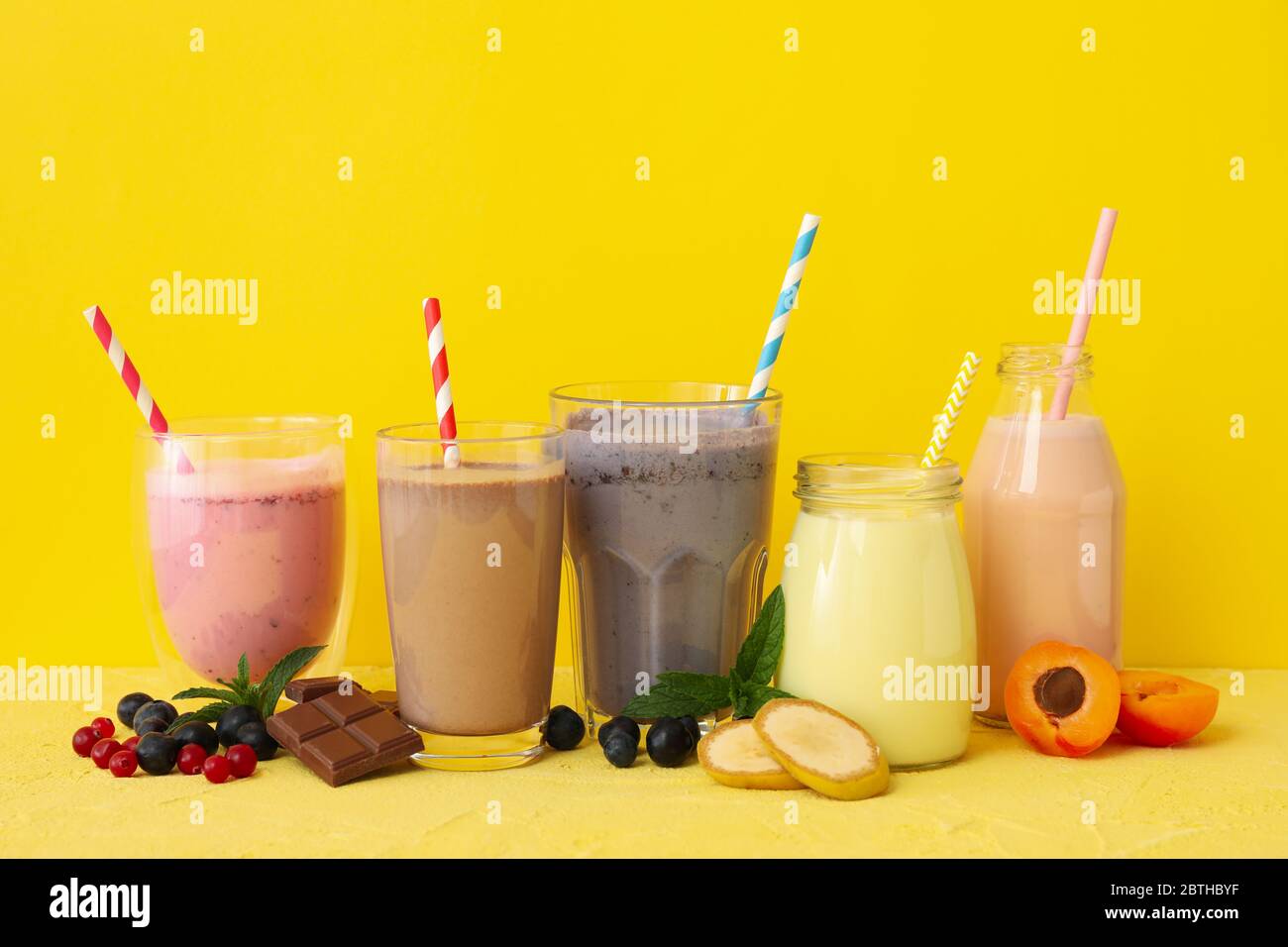 Delicious milkshakes on yellow background. Summer drink Stock Photo - Alamy