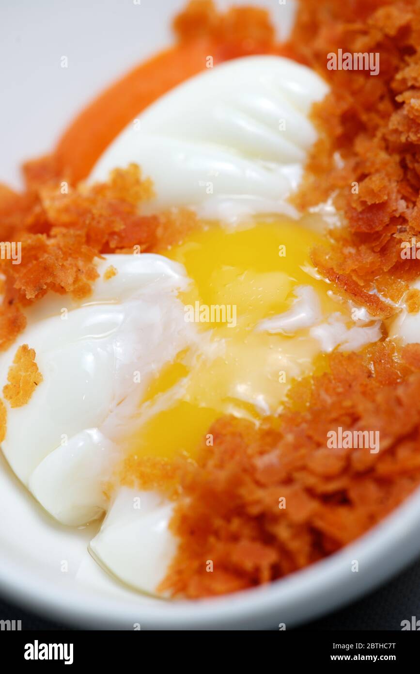 Poached egg in a white bowl Stock Photo - Alamy