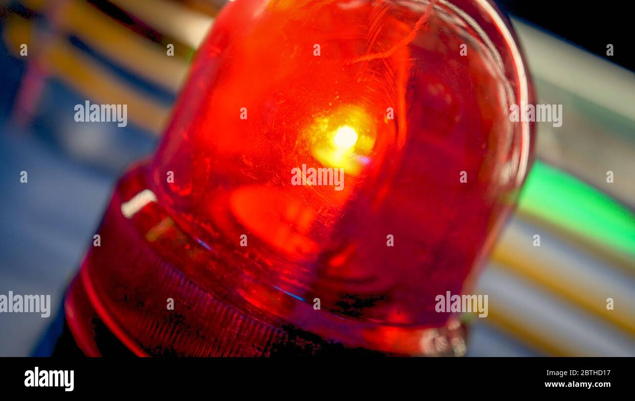 Closeup image of red glowing fire alarm lights on wall at office ...