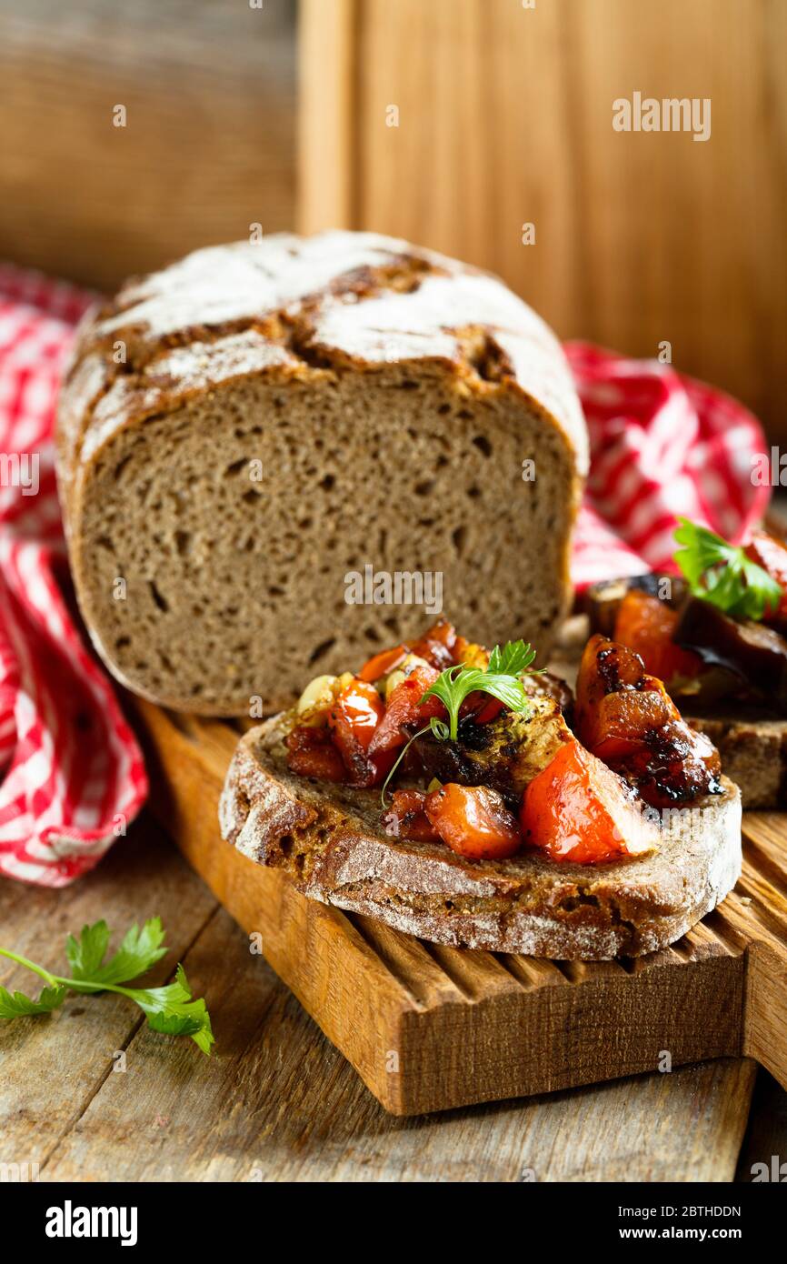 Roasted vegetables on a dark rye bread Stock Photo - Alamy