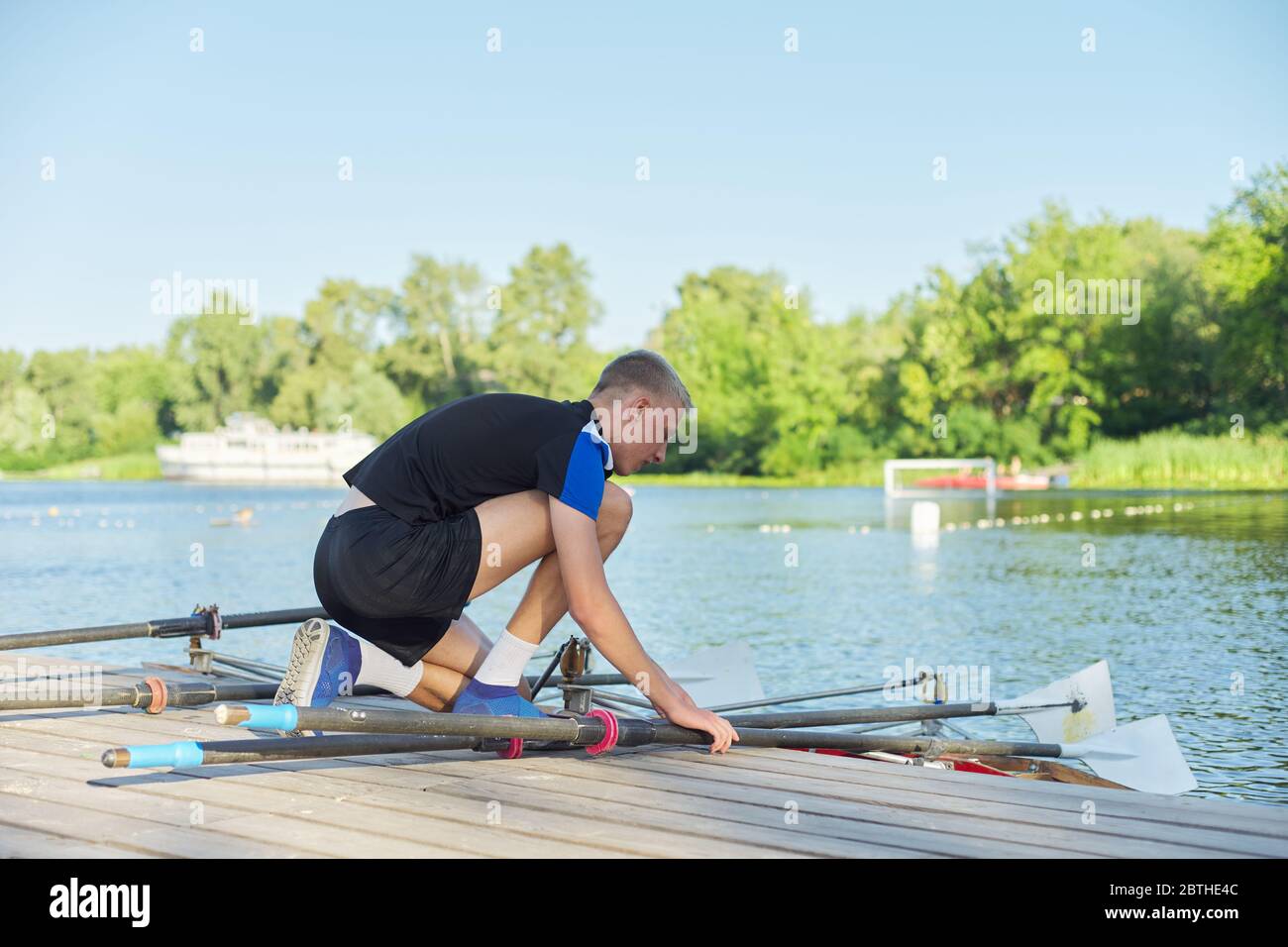 Team of two teenage boys kayaking on river Stock Photo - Alamy