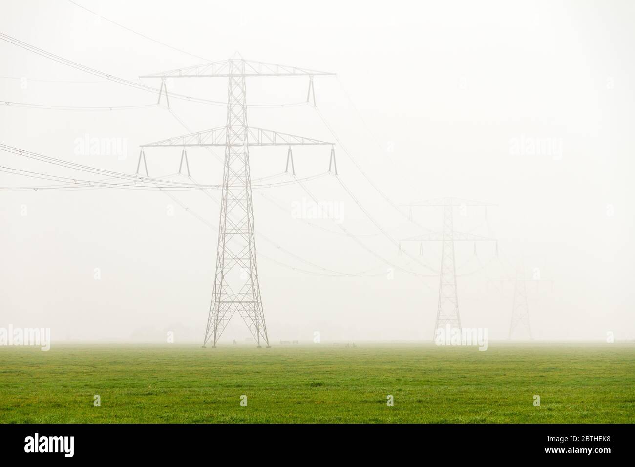 Power pylon from below on a foggy morning in the Netherlands Stock ...
