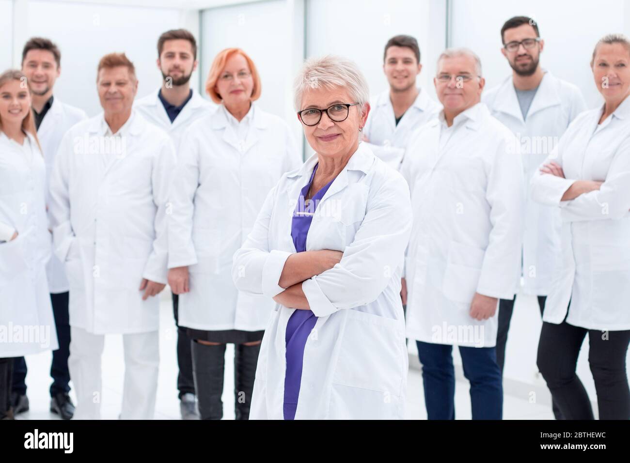 large group of people in white coats standing together Stock Photo - Alamy