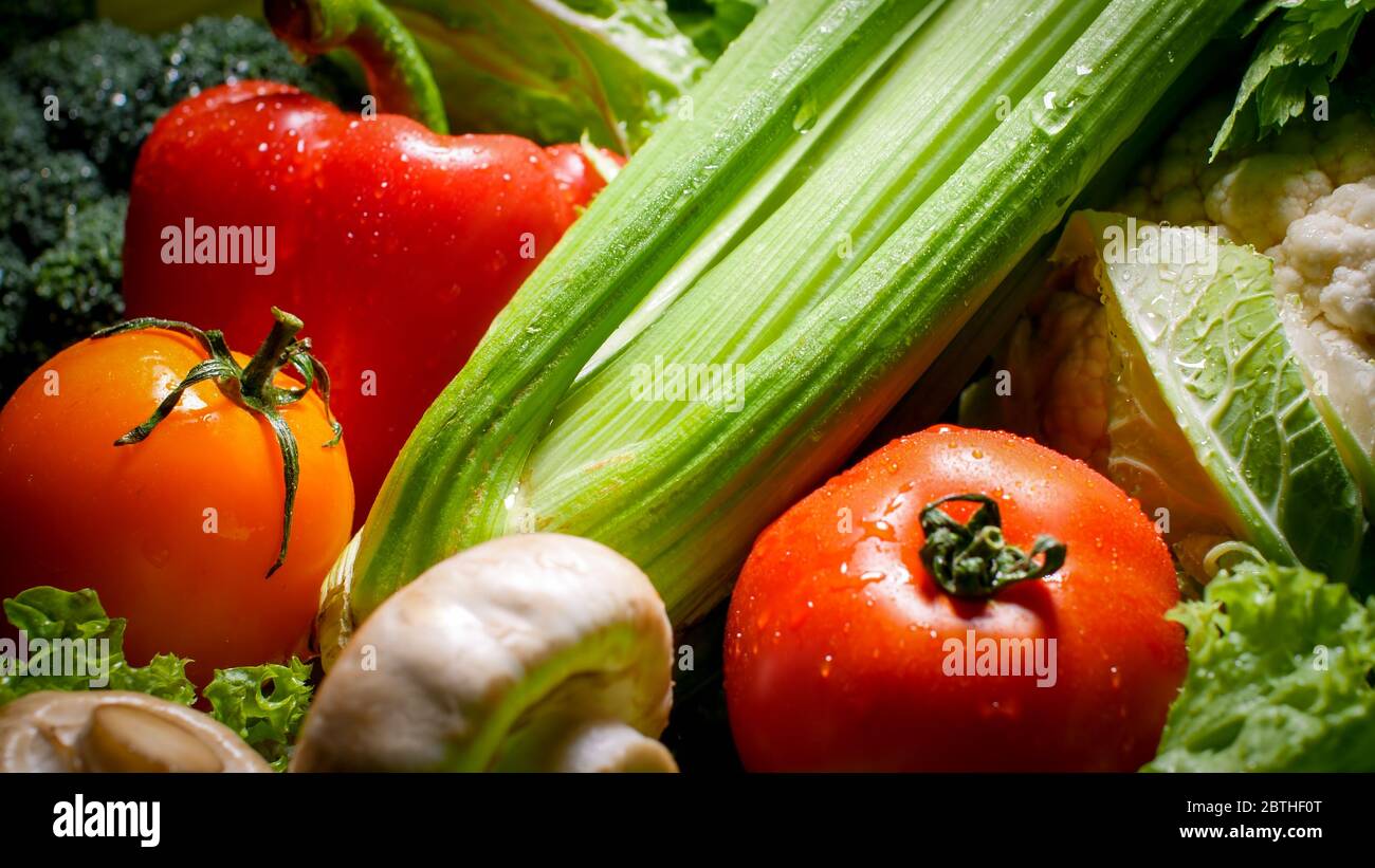 Closeup image of washed wet vegetables on kitchen table prepared for ...
