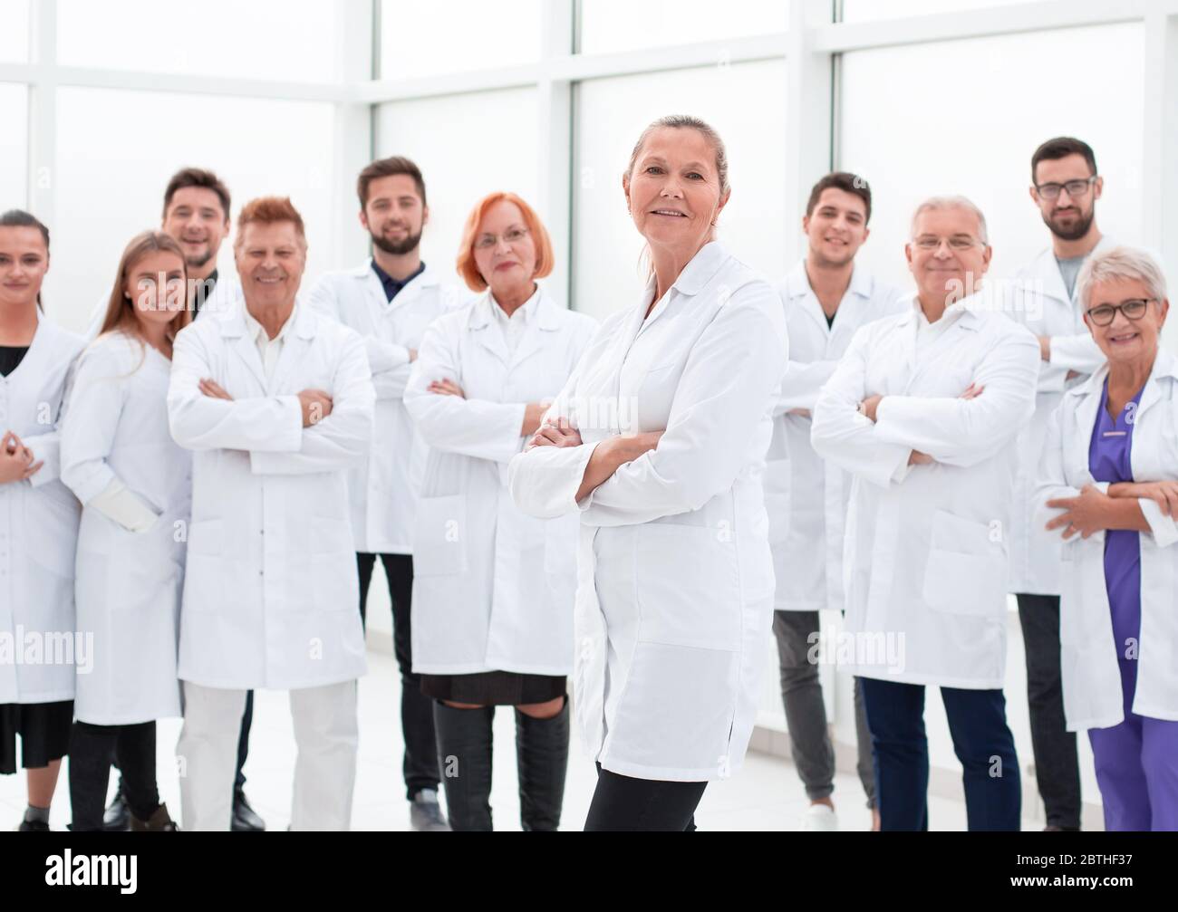 large group of people in white coats standing together Stock Photo - Alamy