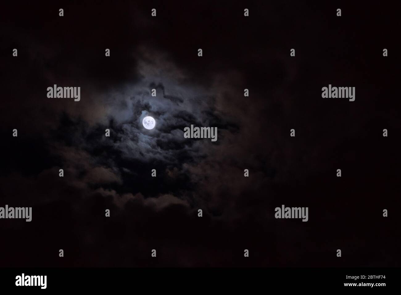 Full moon in the night sky with clouds Stock Photo - Alamy