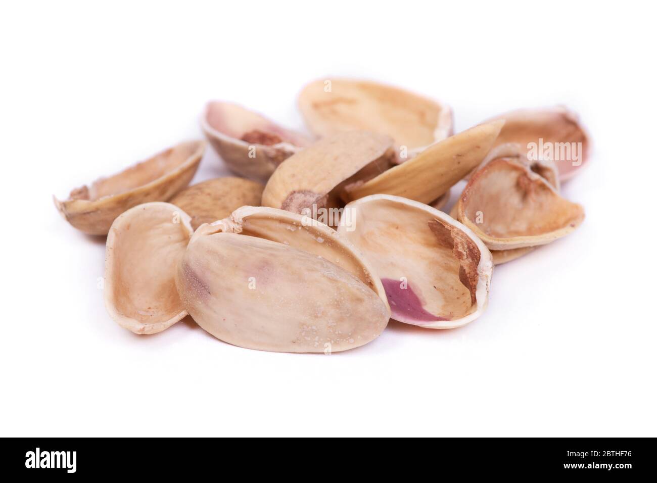 Heap of empty pistachios shells isolated on white background Stock ...