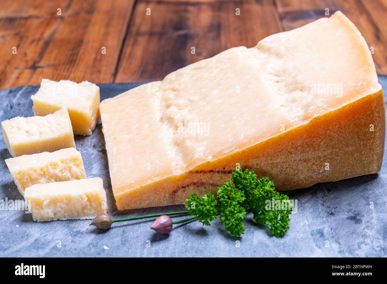 Big wedge of parmigiano-reggiano parmesan hard Italian cheese made from ...