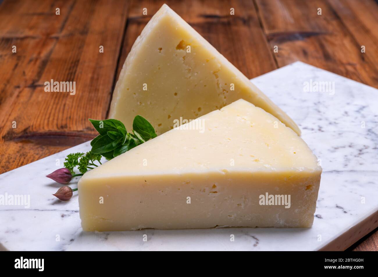 Pieces of matured pecorino romano italian cheese made from sheep milk ...