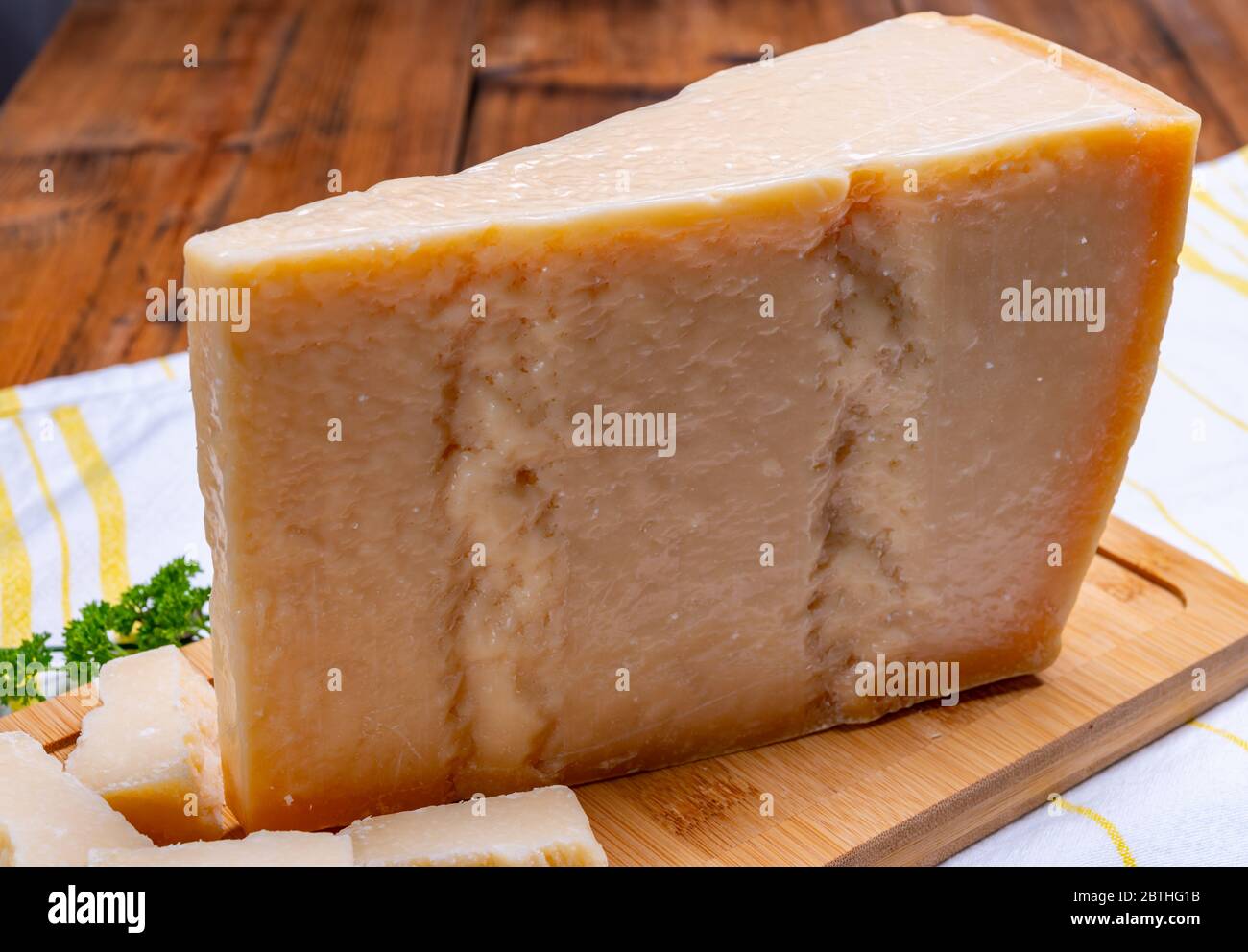 Big wedge of parmigiano-reggiano parmesan hard Italian cheese made from ...