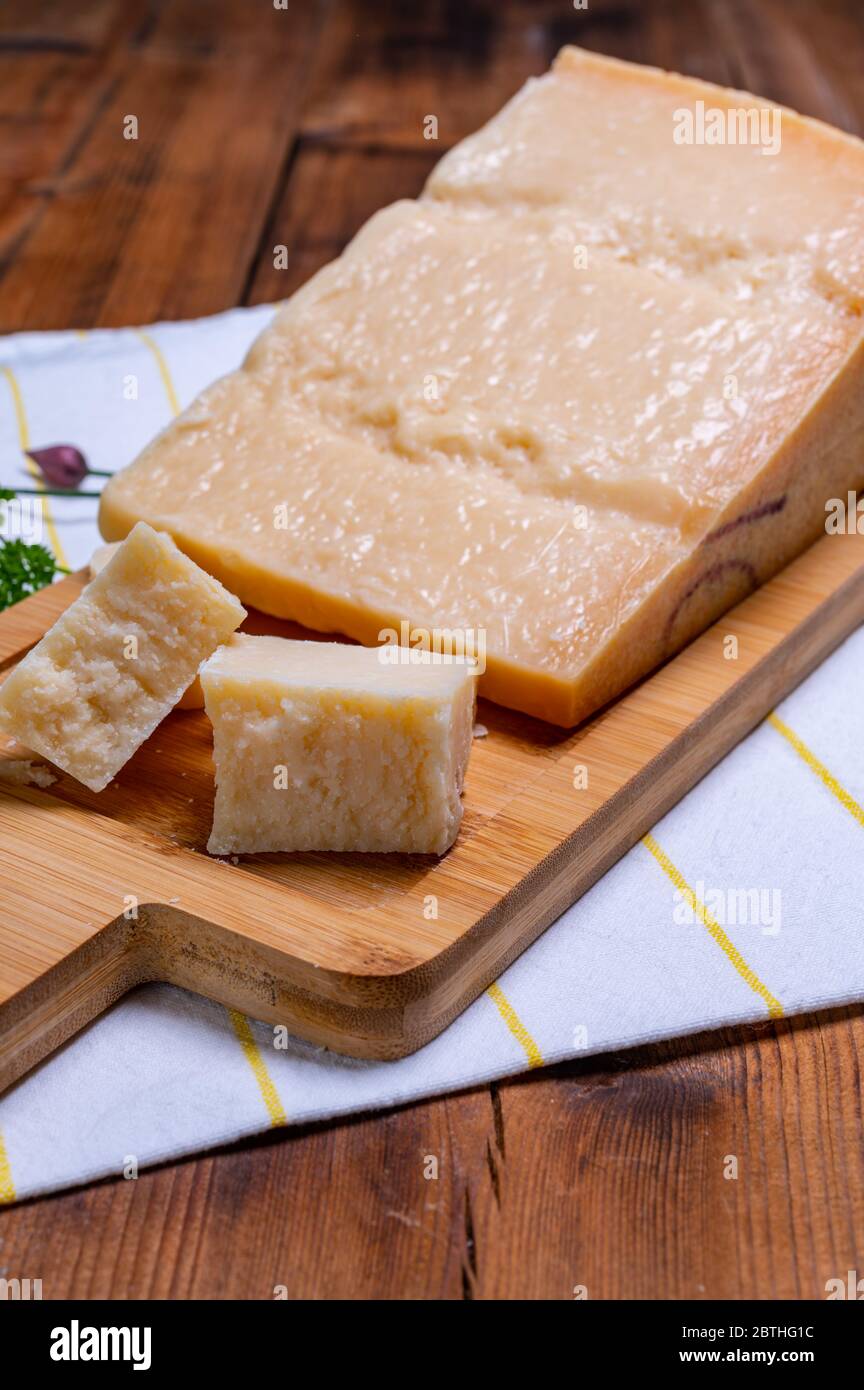 Big wedge of parmigiano-reggiano parmesan hard Italian cheese made from ...