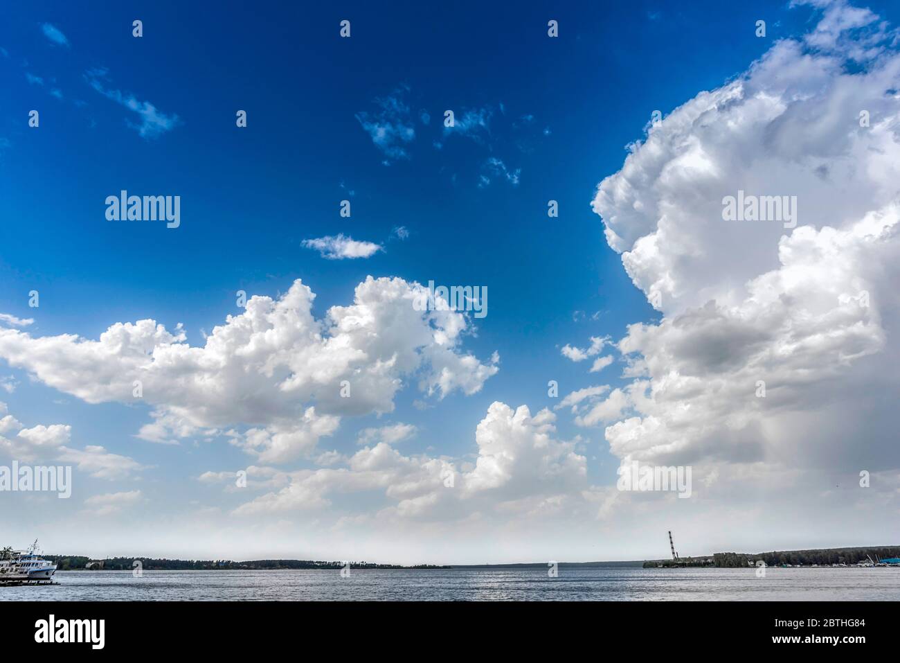 Beautiful clouds over the river Stock Photo - Alamy