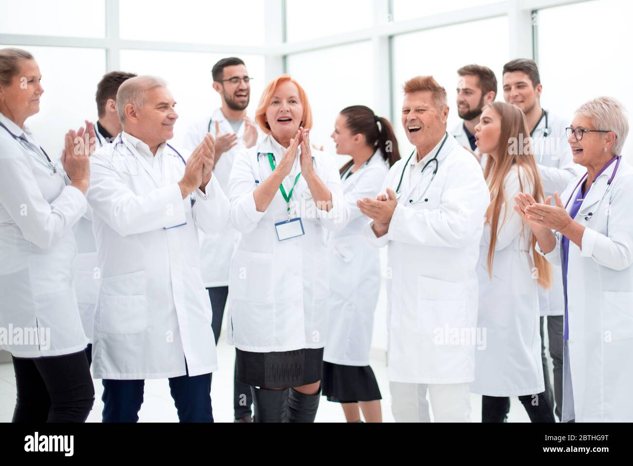 group of diverse smiling doctors applauding together Stock Photo - Alamy
