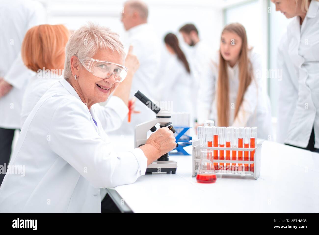 female scientist sitting at a Desk in the laboratory Stock Photo - Alamy