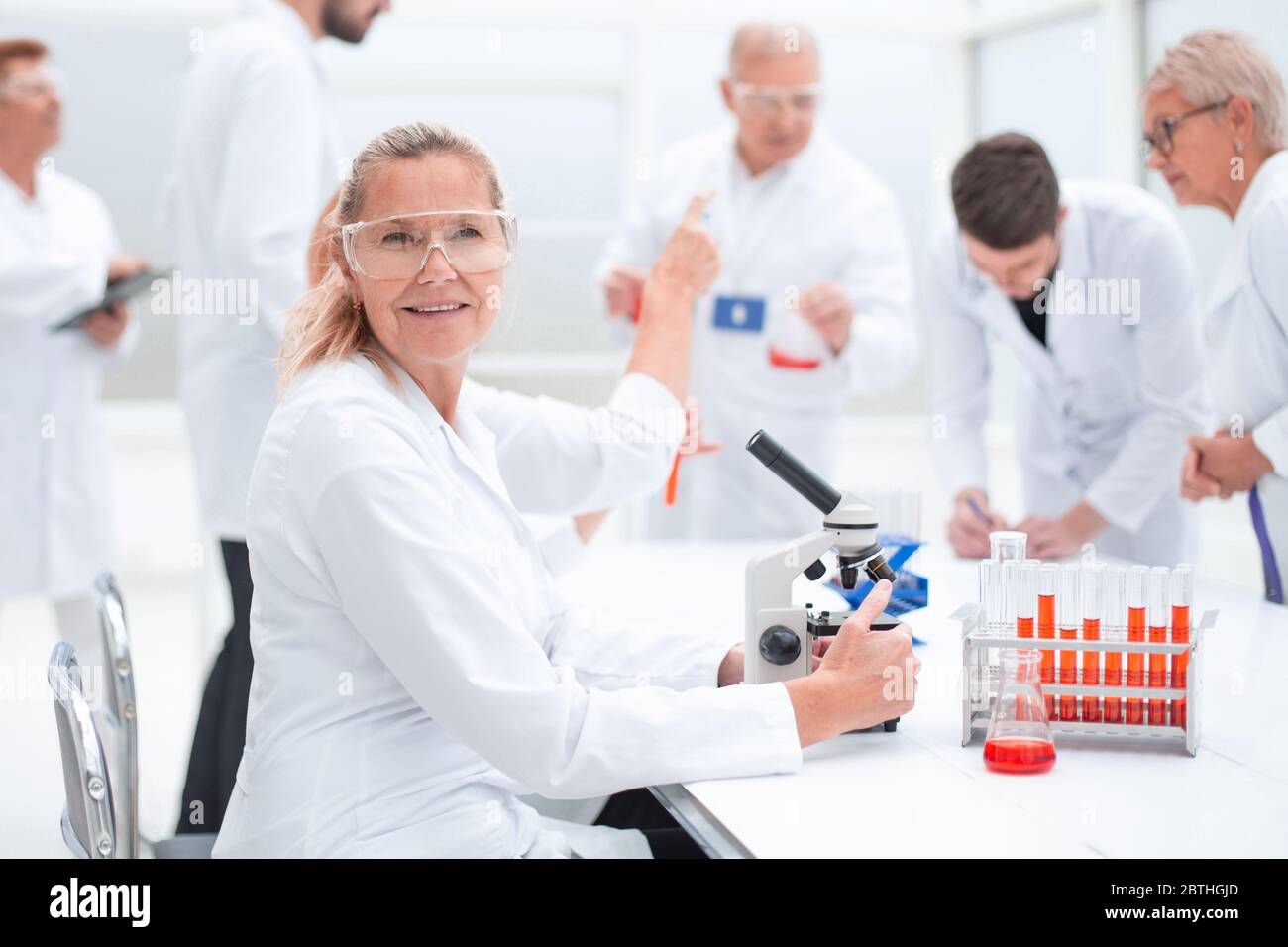 Senior woman microscope scientist hi-res stock photography and images ...