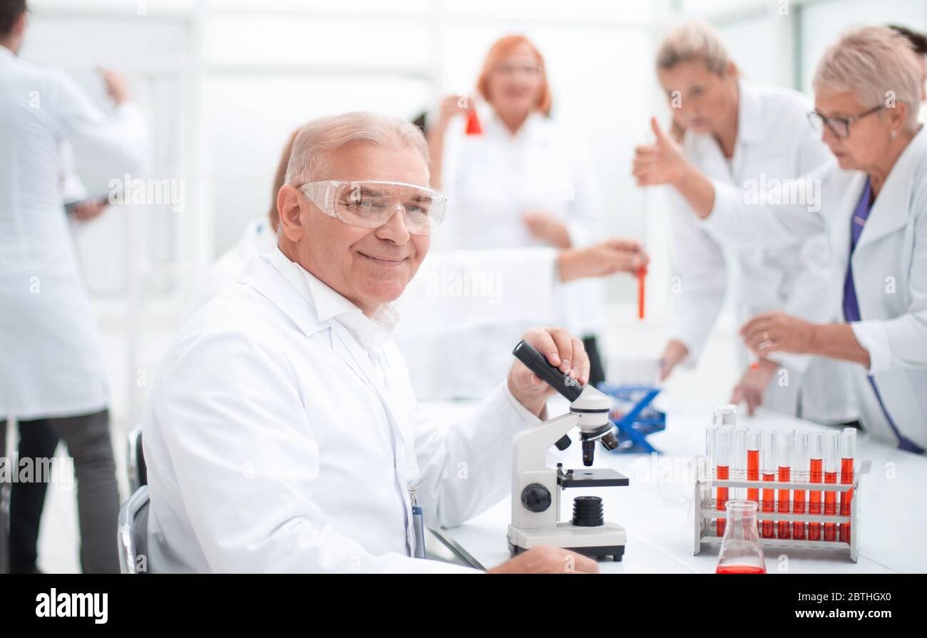 smiling scientist at the workplace in the laboratory Stock Photo - Alamy