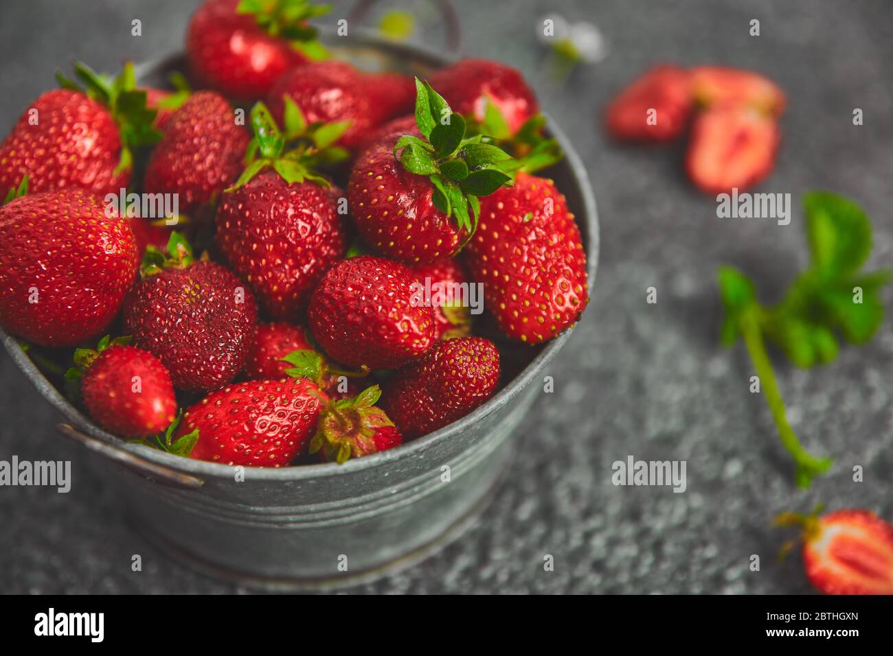 Strawberries in grey bowl. Fresh strawberries. Beautiful strawberries ...