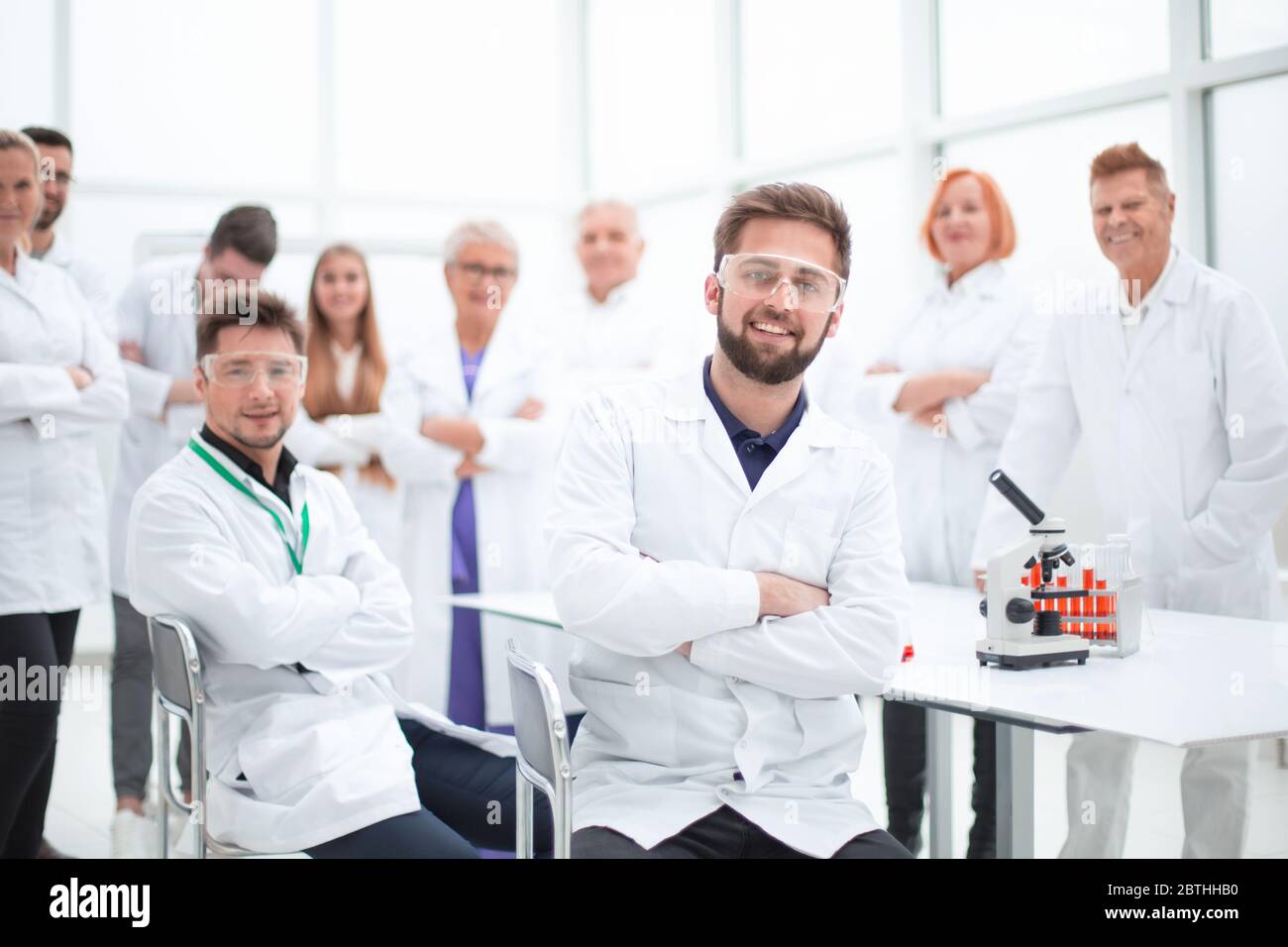 best researcher and his colleagues in the workplace Stock Photo - Alamy