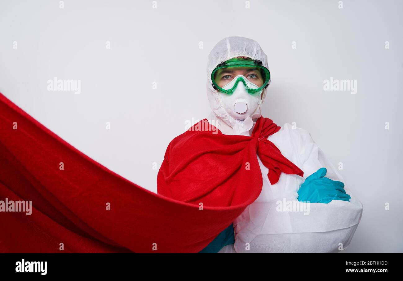 Doctor is wearing PPE - costume, gloves and surgical face mask in ...