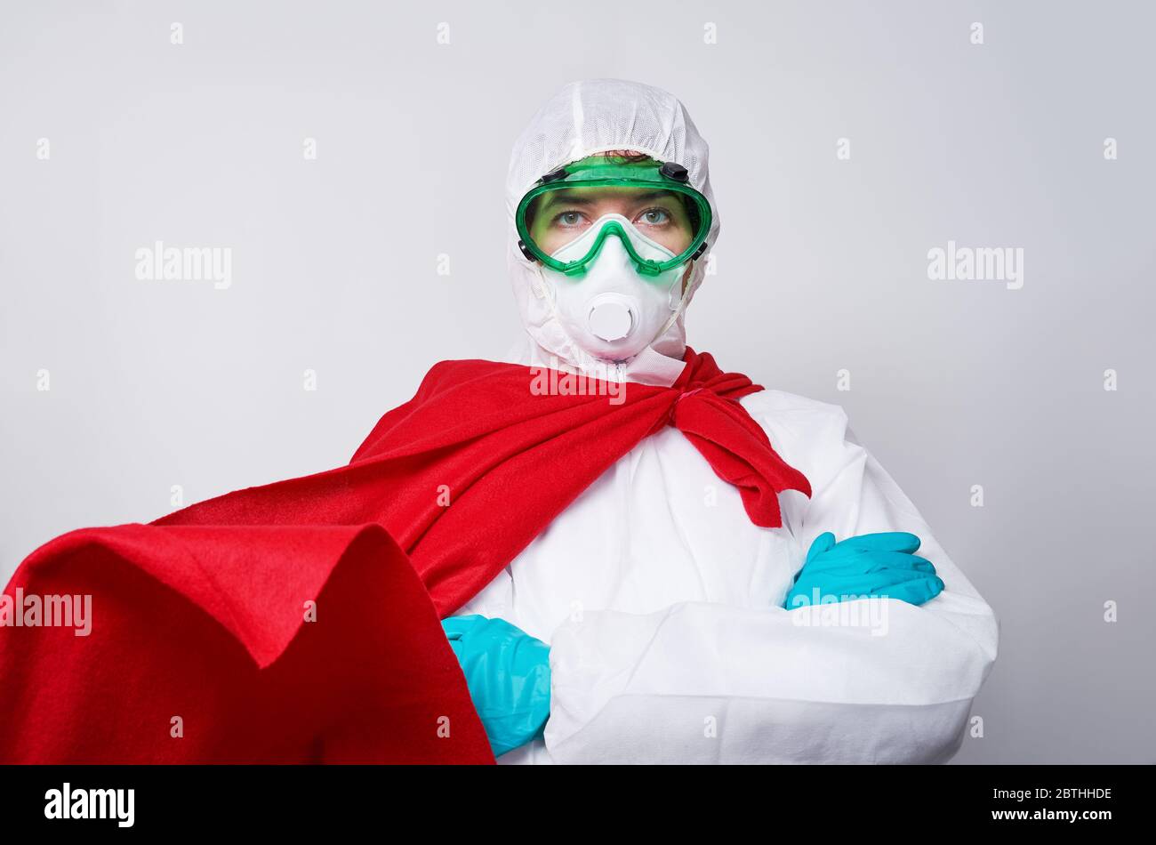 Doctor is wearing PPE - costume, gloves and surgical face mask in ...