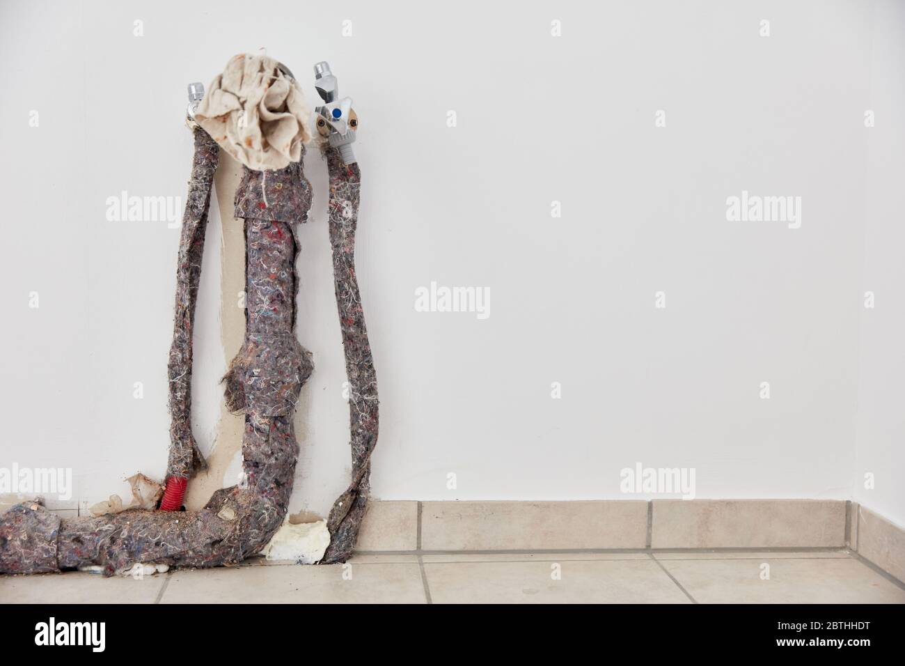 Water connection with valve and pipe on wall in the kitchen Stock Photo ...