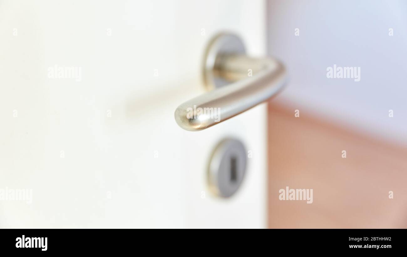 Handle on an open door in a house or apartment Stock Photo - Alamy