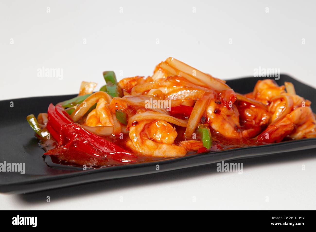 Delicious typical Japanese prawn dish with spicy sauce on white ...