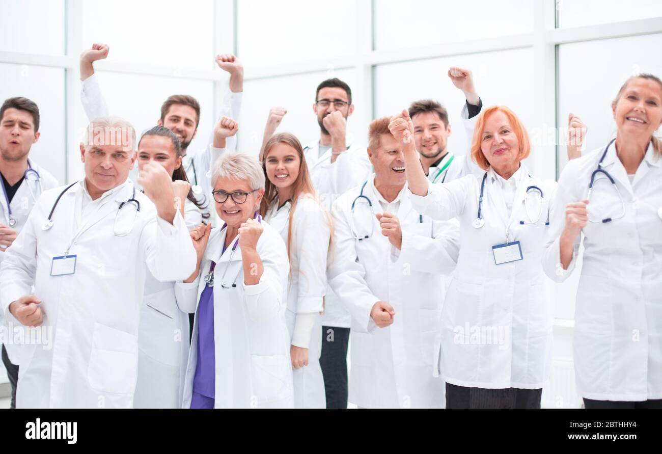close up. large group of doctors showing their success Stock Photo - Alamy