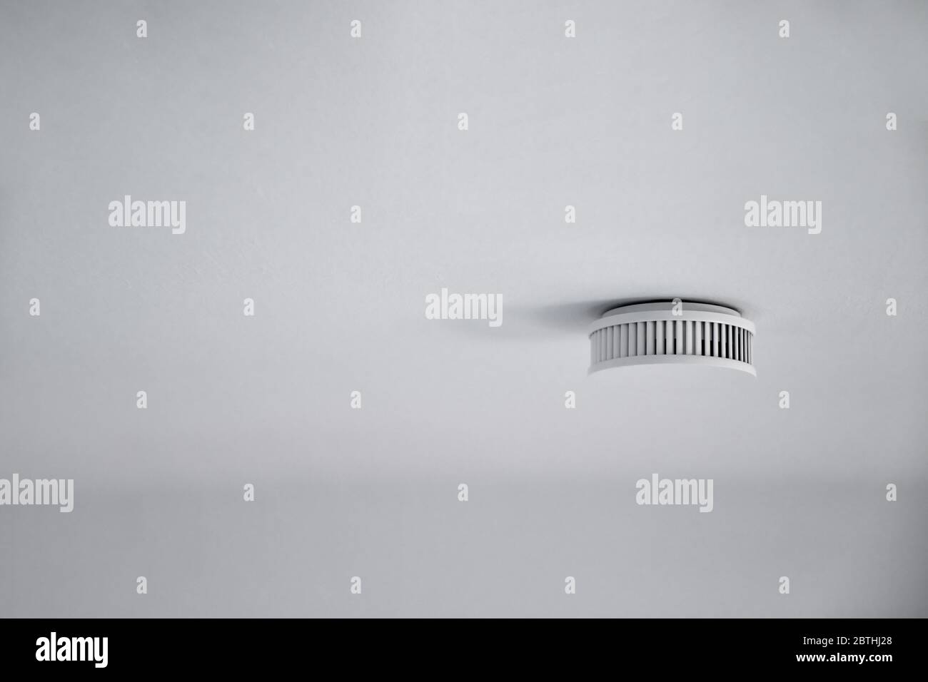 Smoke detector in the apartment or office on the ceiling as fire ...