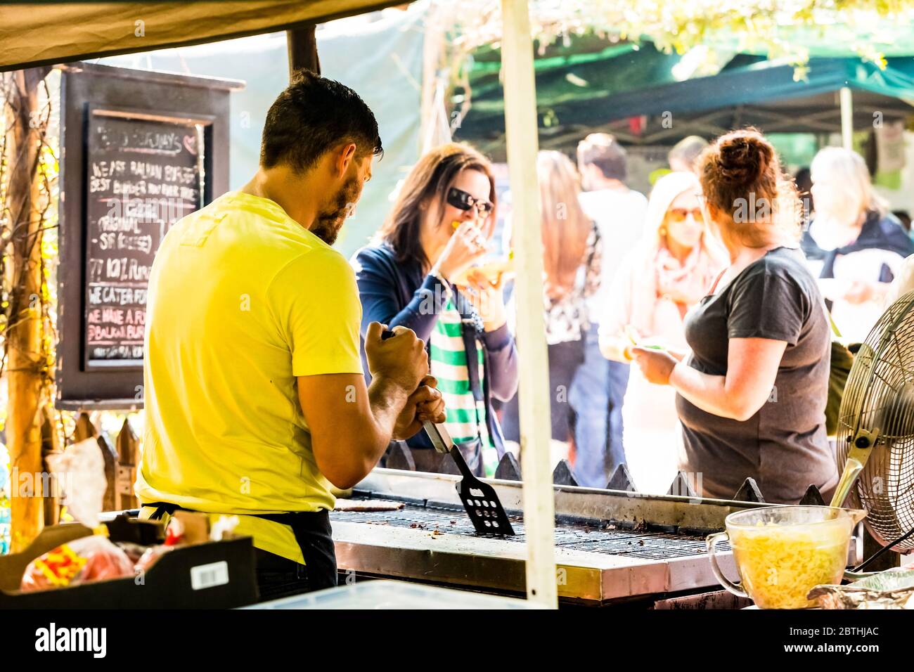 Johannesburg, South Africa - May 24, 2015: Male chef vendor working a ...