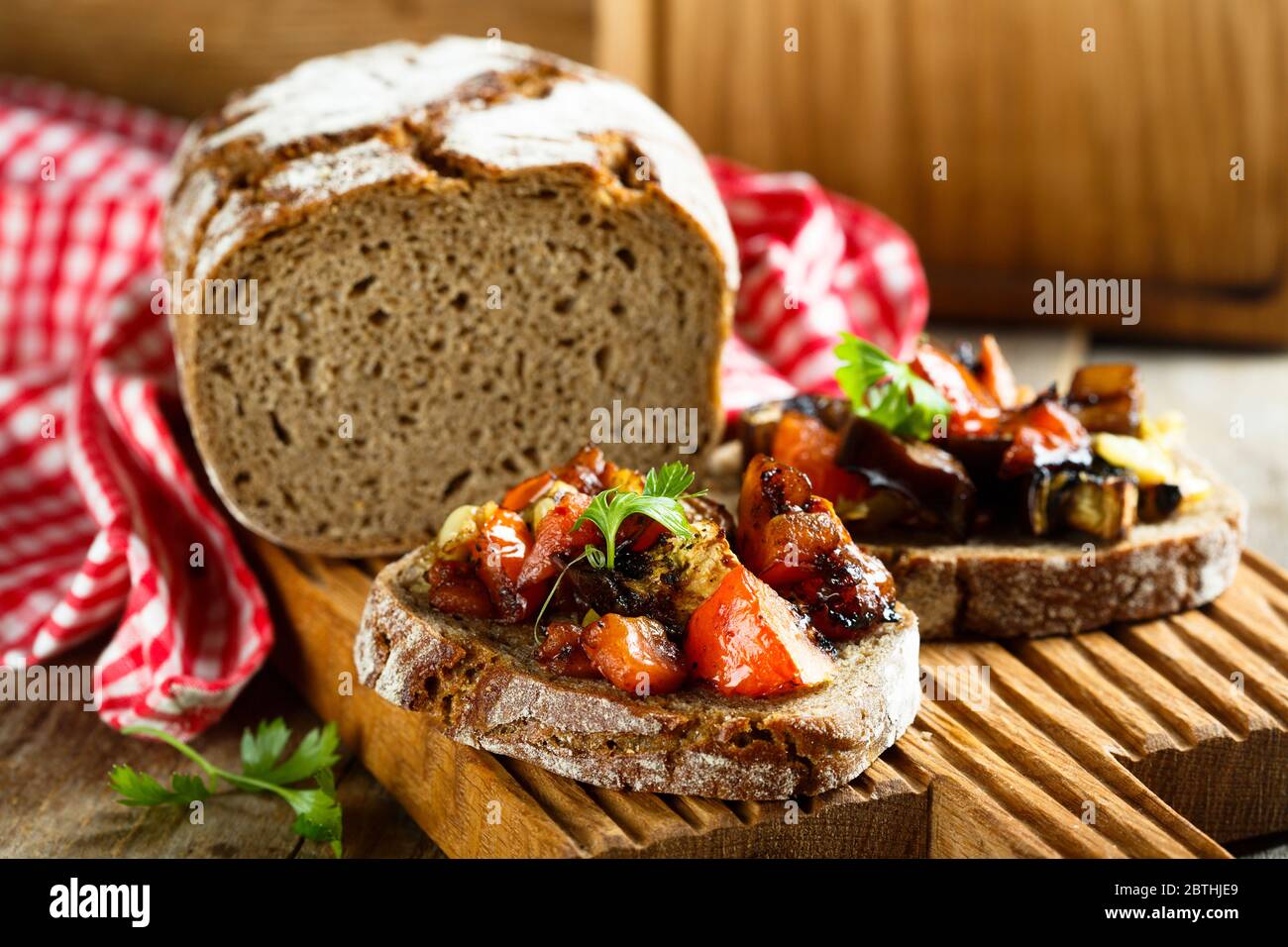 Roasted vegetables on a dark rye bread Stock Photo - Alamy