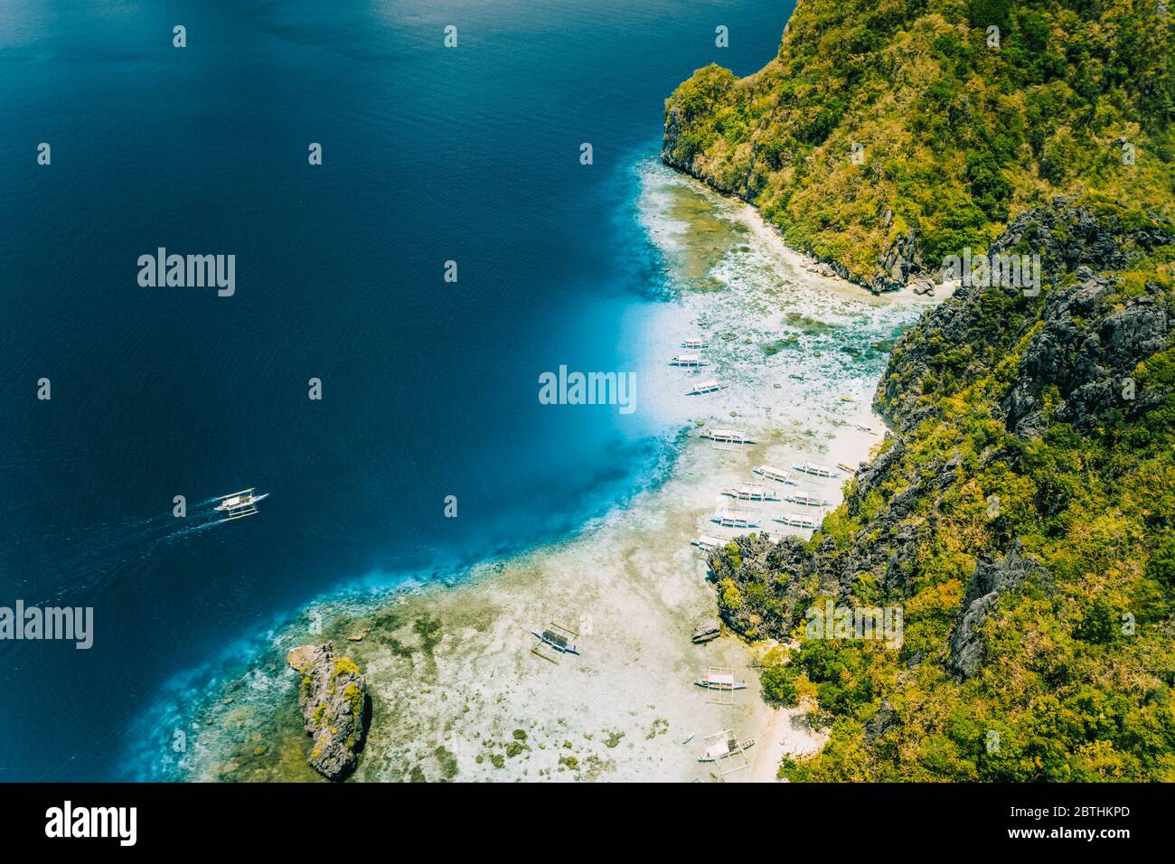 Aerial drone view of tropical Shimizu Island. Limestone coastal rocks ...