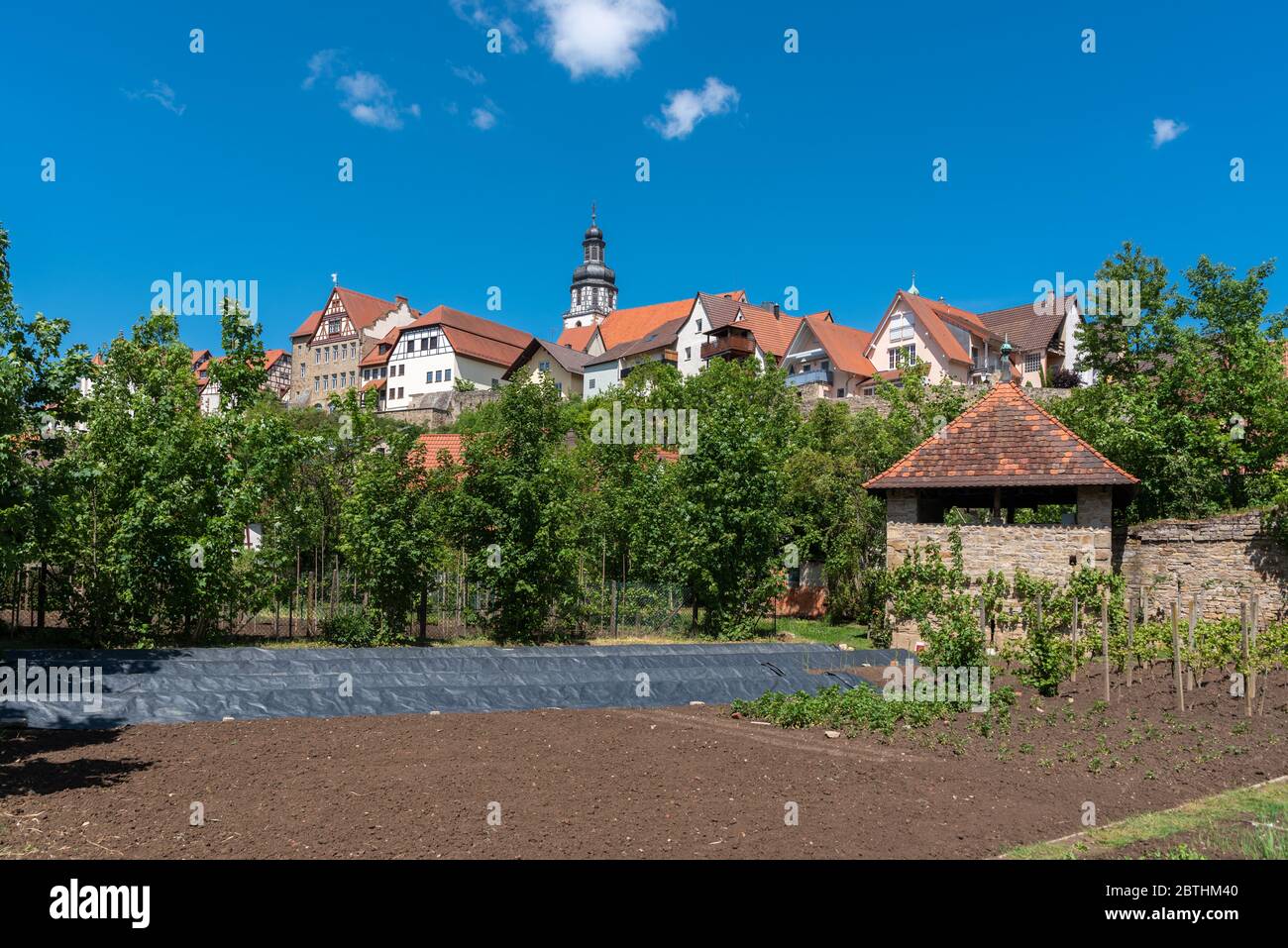 Cityscape with historic city wall and St Martin church, Gochsheim ...