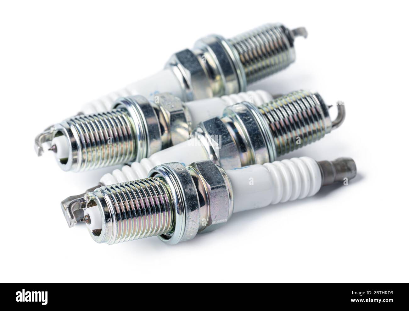 Car part. Spark plugs isolated on white Stock Photo - Alamy