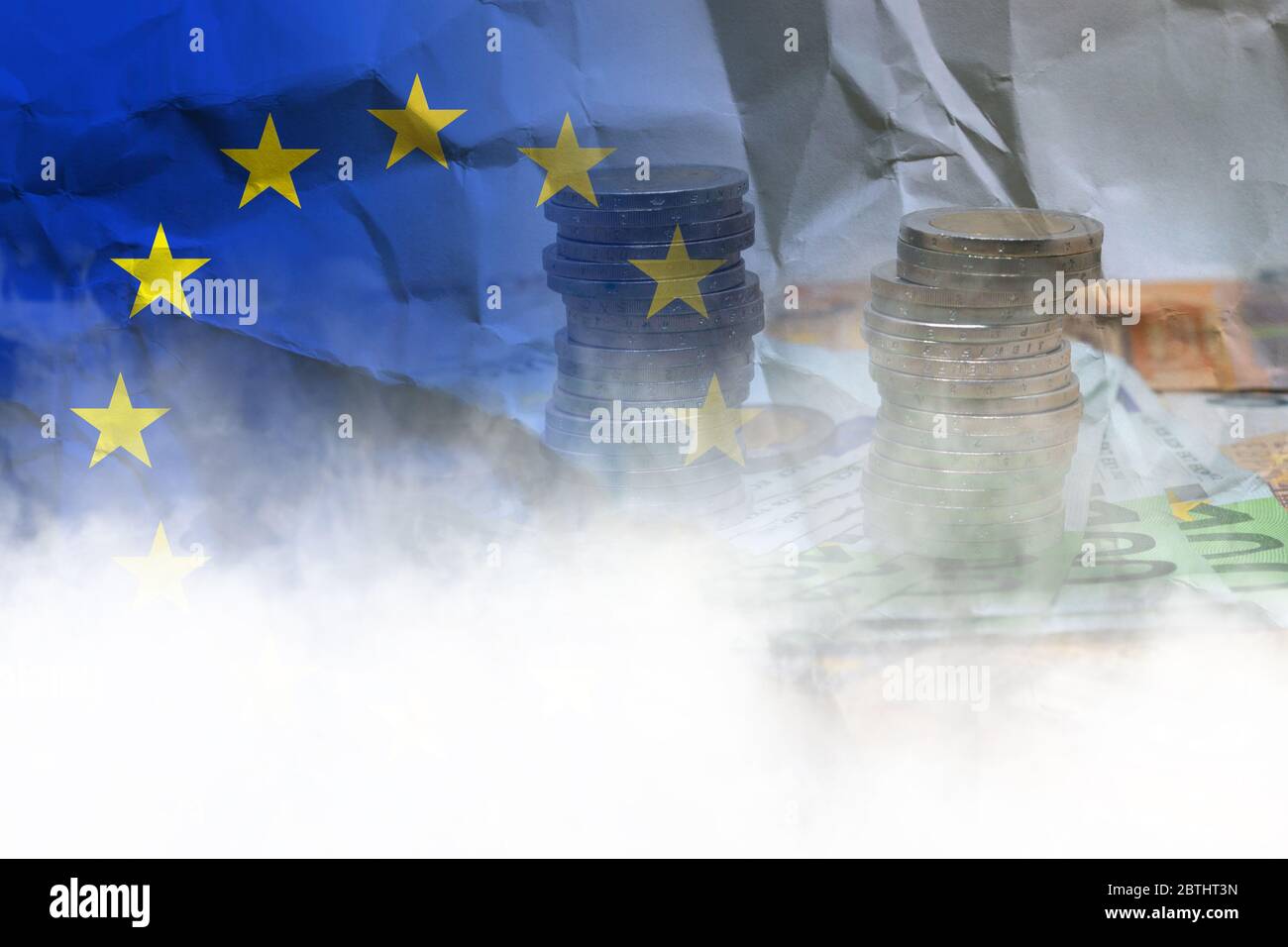 European flag and euro coin on crumpled paper.European flag and euro ...