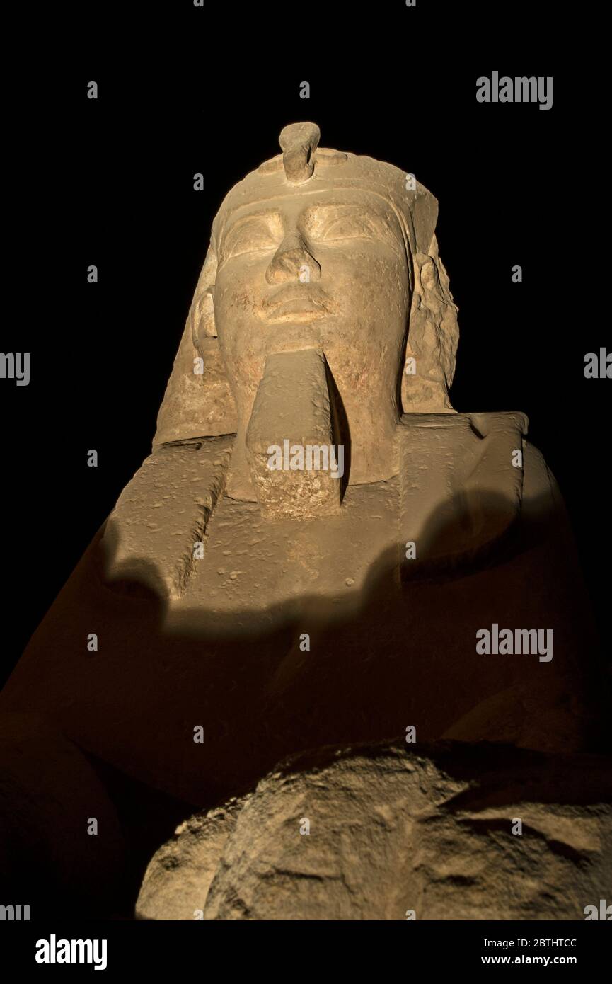 Ancient egyptian stone sphinx lit up in night at temple of Luxor Stock ...