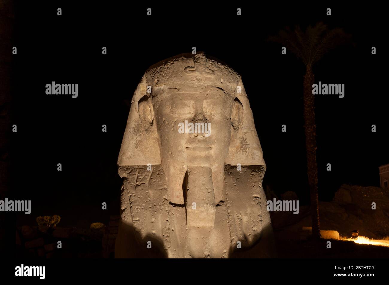 Ancient egyptian stone sphinx lit up in night at temple of Luxor Stock ...