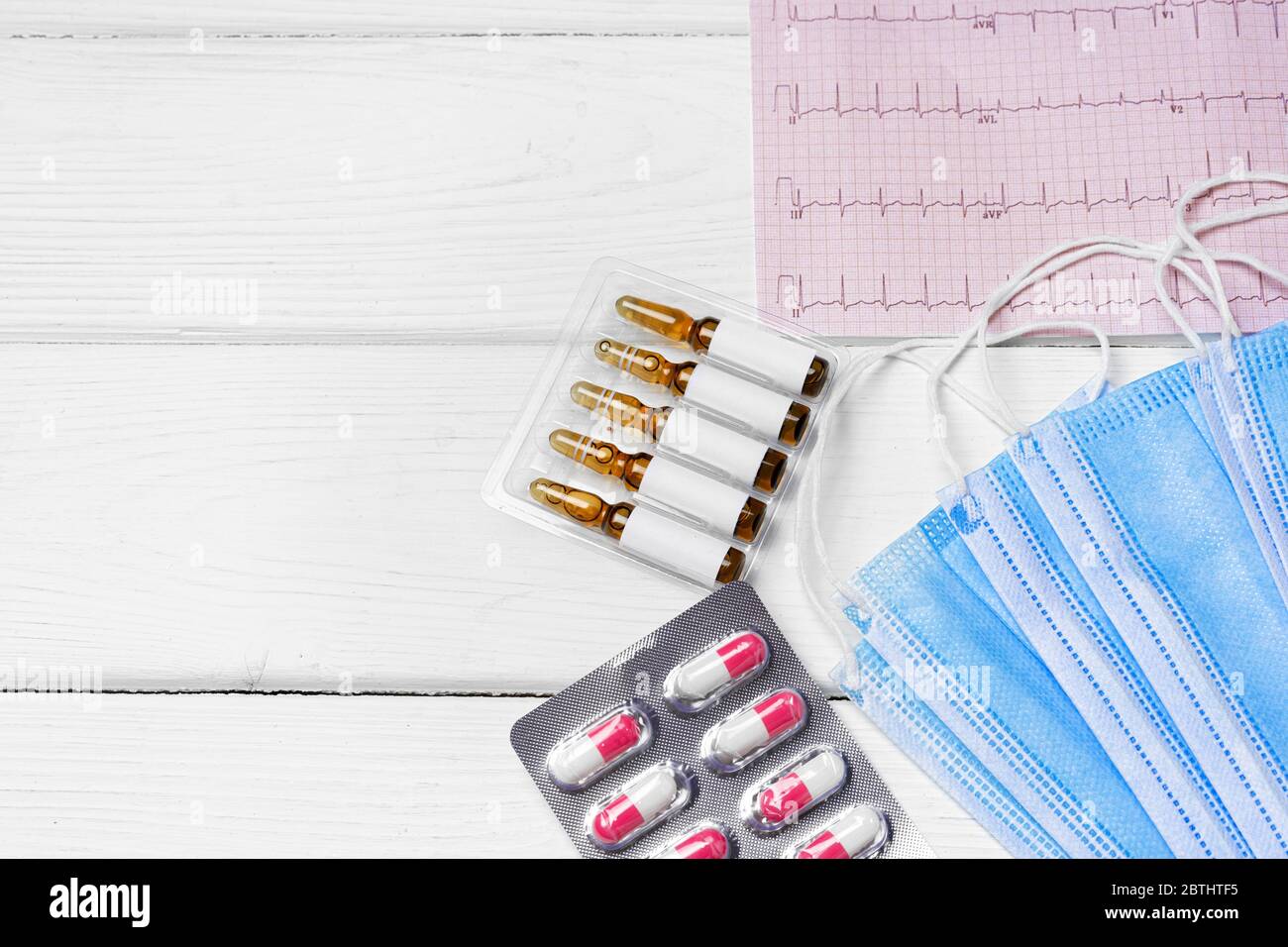 Medical capsules, ampules and face masks close up Stock Photo - Alamy