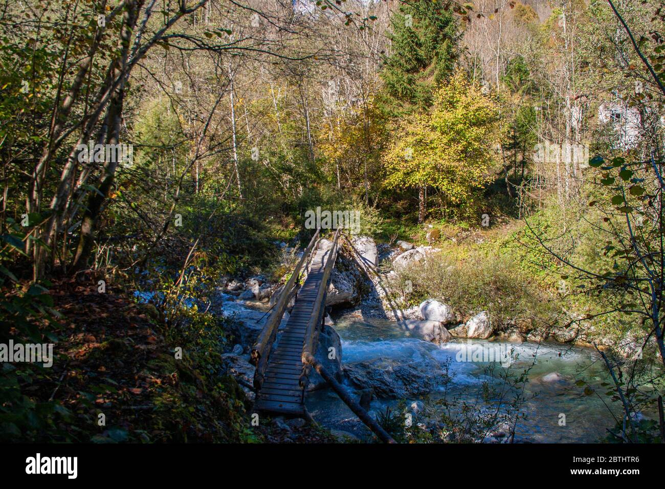 Suspension bridge over canyon waterfall hi-res stock photography and ...
