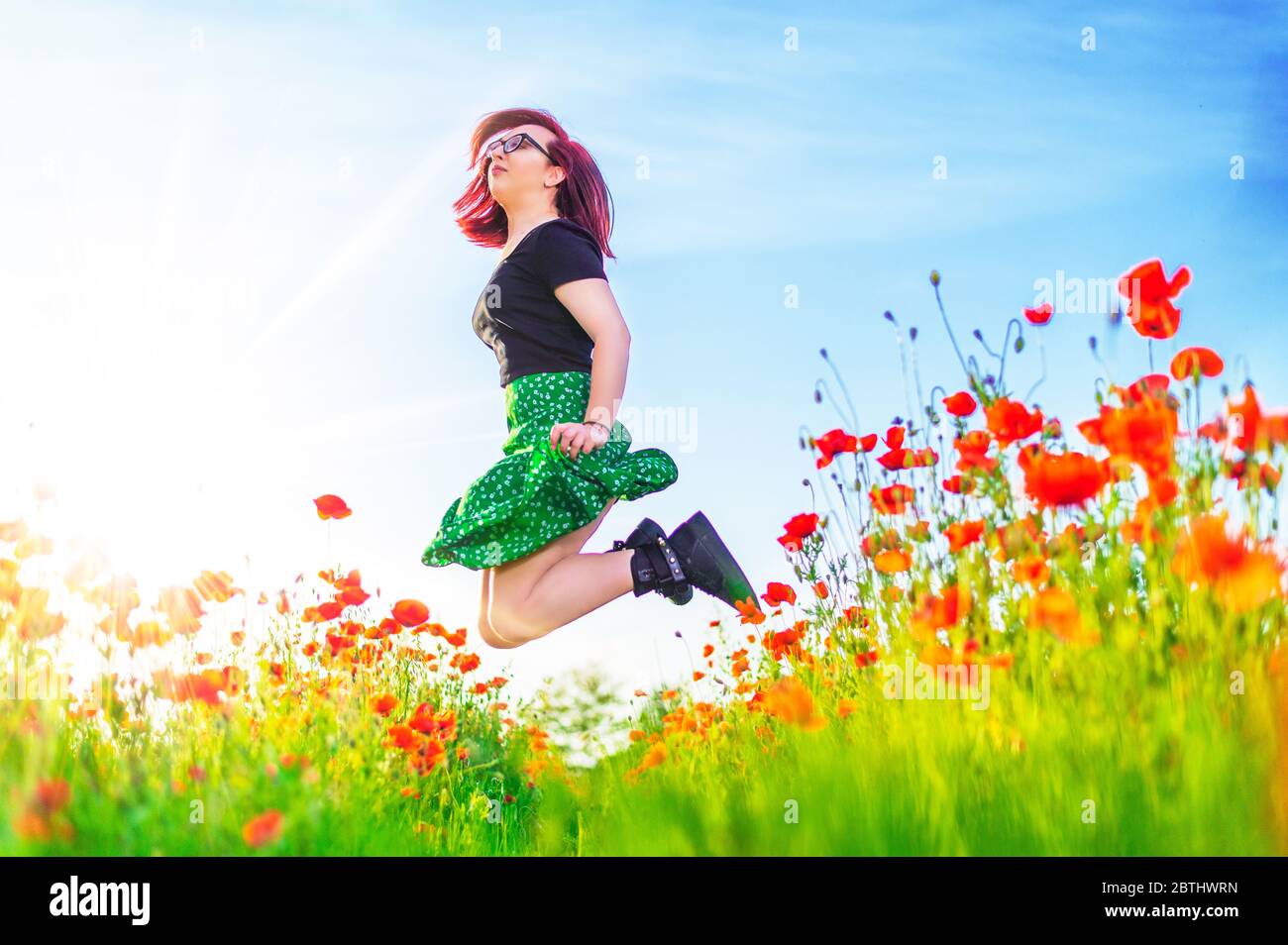 Jumping over flowers hi-res stock photography and images - Alamy