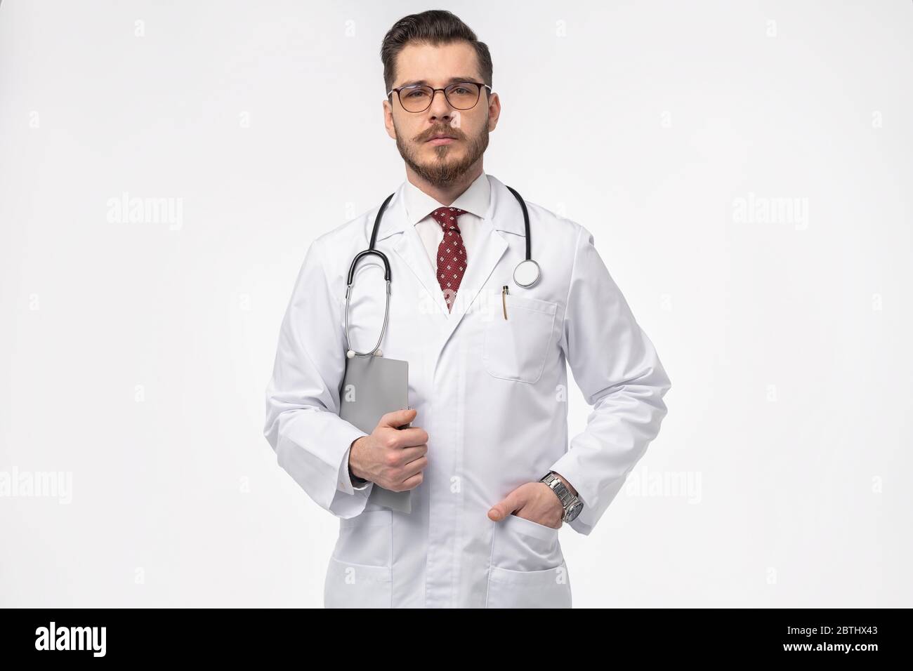 Smiling medical doctor. Isolated over white background Stock Photo - Alamy