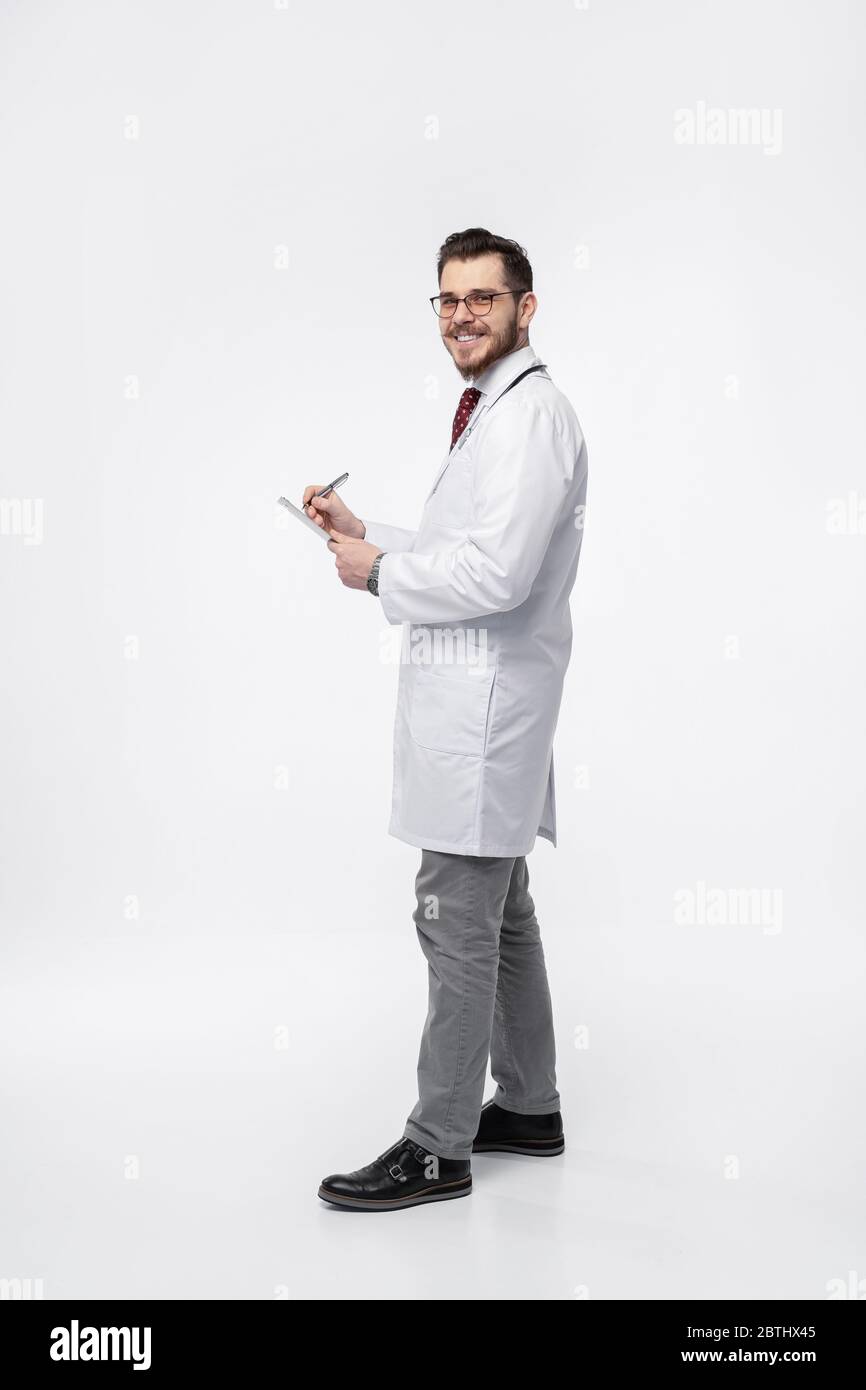 Smiling medical doctor. Isolated over white background Stock Photo - Alamy