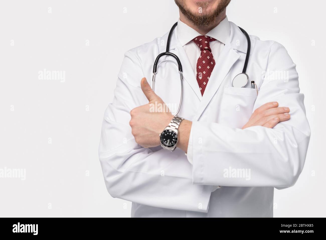Smiling medical doctor. Isolated over white background Stock Photo - Alamy